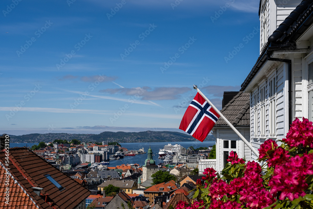 The Norwegian flag is placed on the facade of the house in Bergen ...