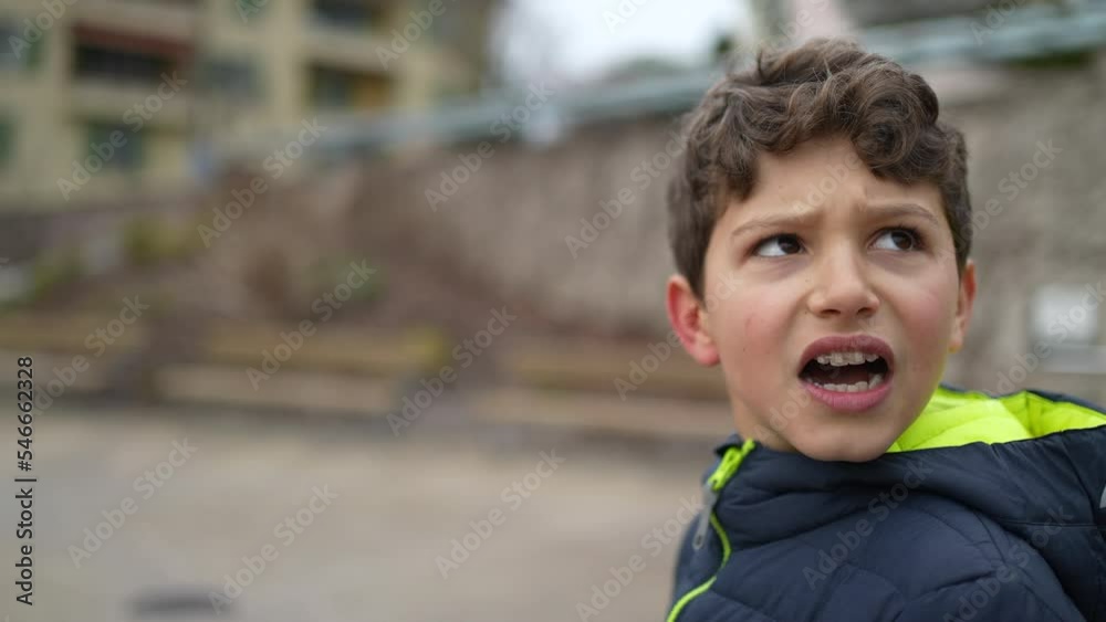 One upset preteen child turning head with concerned emotion. Tracking ...