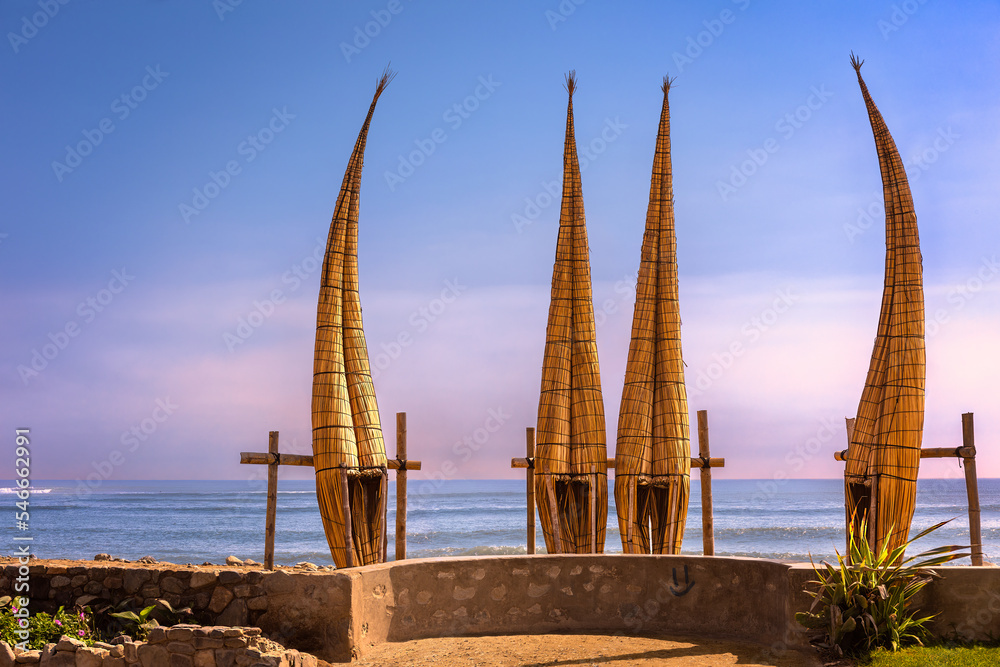 Traditional reed boats, called Caballitos de Totora, on the beach of ...