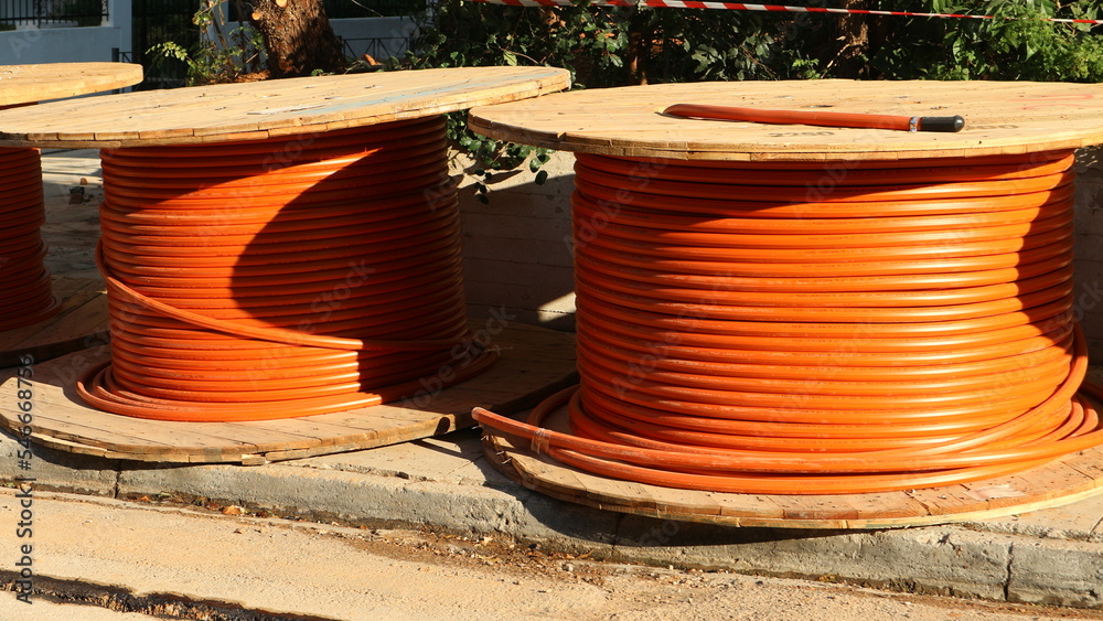 Optical fiber cable drums waiting for installation on the curbside ...