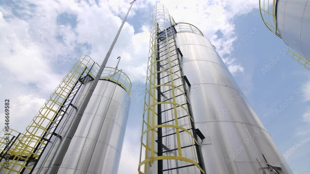 Service ladders on high metal tanks at carbon fiber manufacturing plant ...
