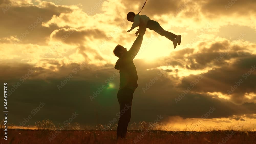 Family trust. Active dad plays with his daughter, throws child into sky ...