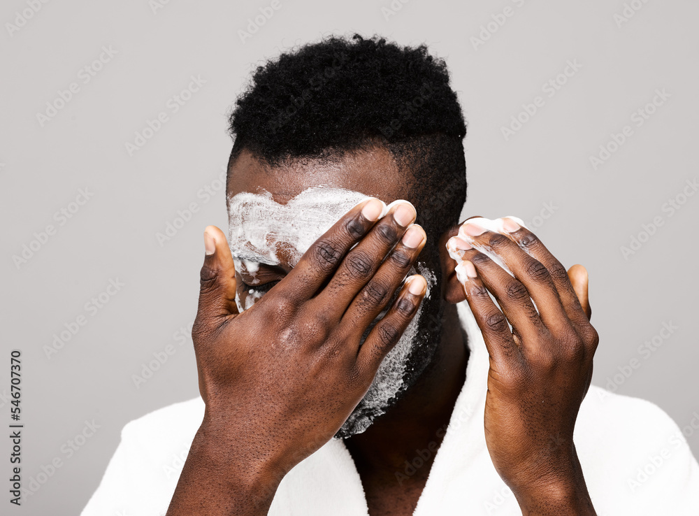 Unrecognisable man using face wash Stock Photo | Adobe Stock