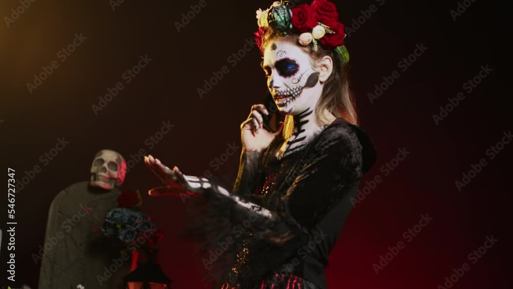 Spooky goddess talking on phone call with smartphone, wearing flowers ...