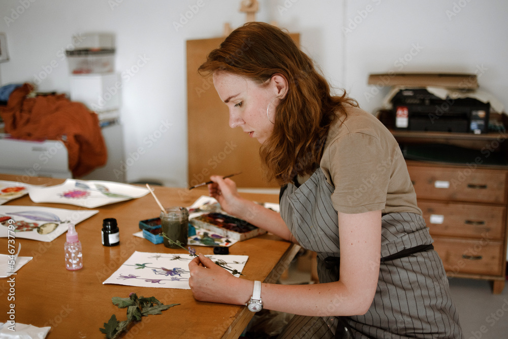 Woman drawing in the studio Stock Photo | Adobe Stock