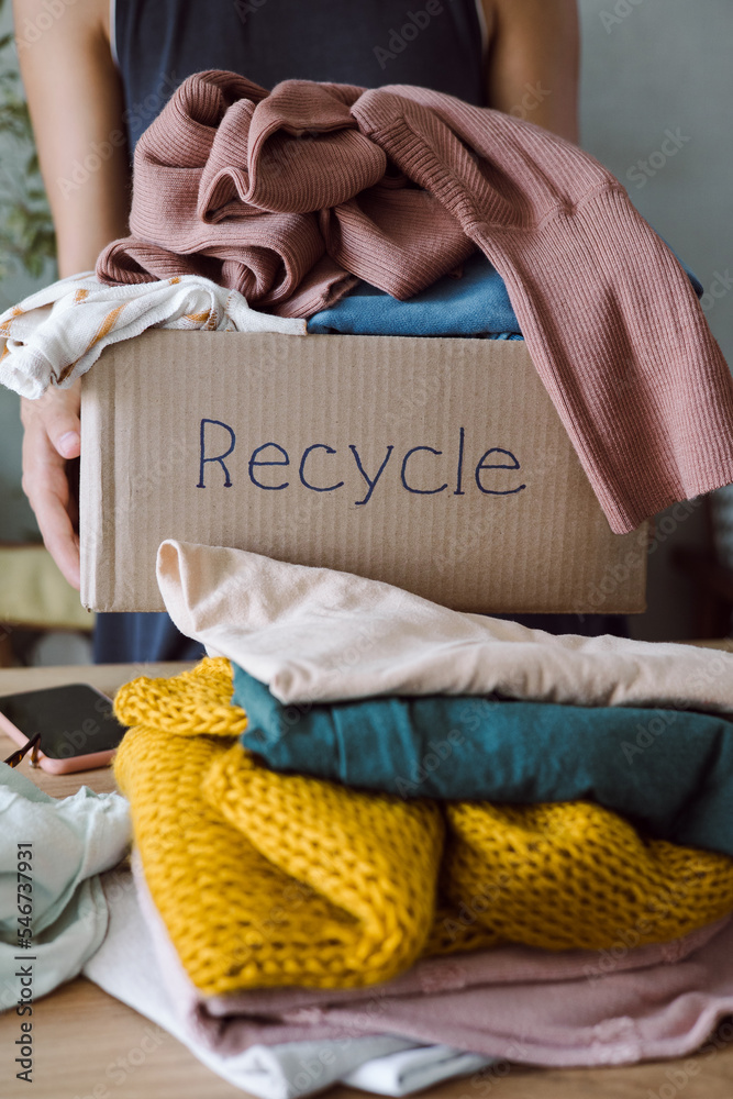 Old clothes in a cardboard box before being sent for recycling Stock ...