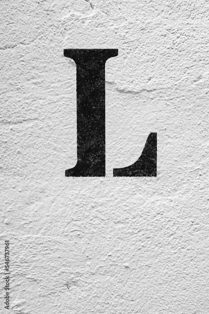 Distressed Brick Wall Background with a painted letter L. Stock Photo ...