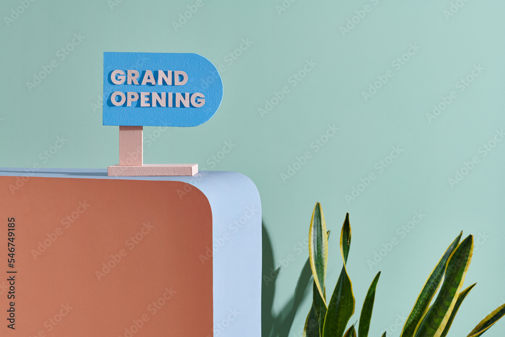 wording 'Grand Opening' sign concept with small signboard on Stock ...
