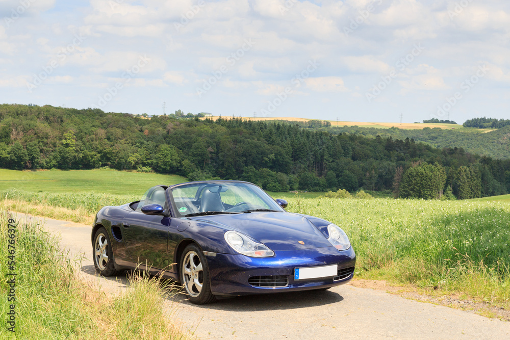 Hunsrück, Germany - June 26, 2021: Blue roadster Porsche Boxster 986 ...