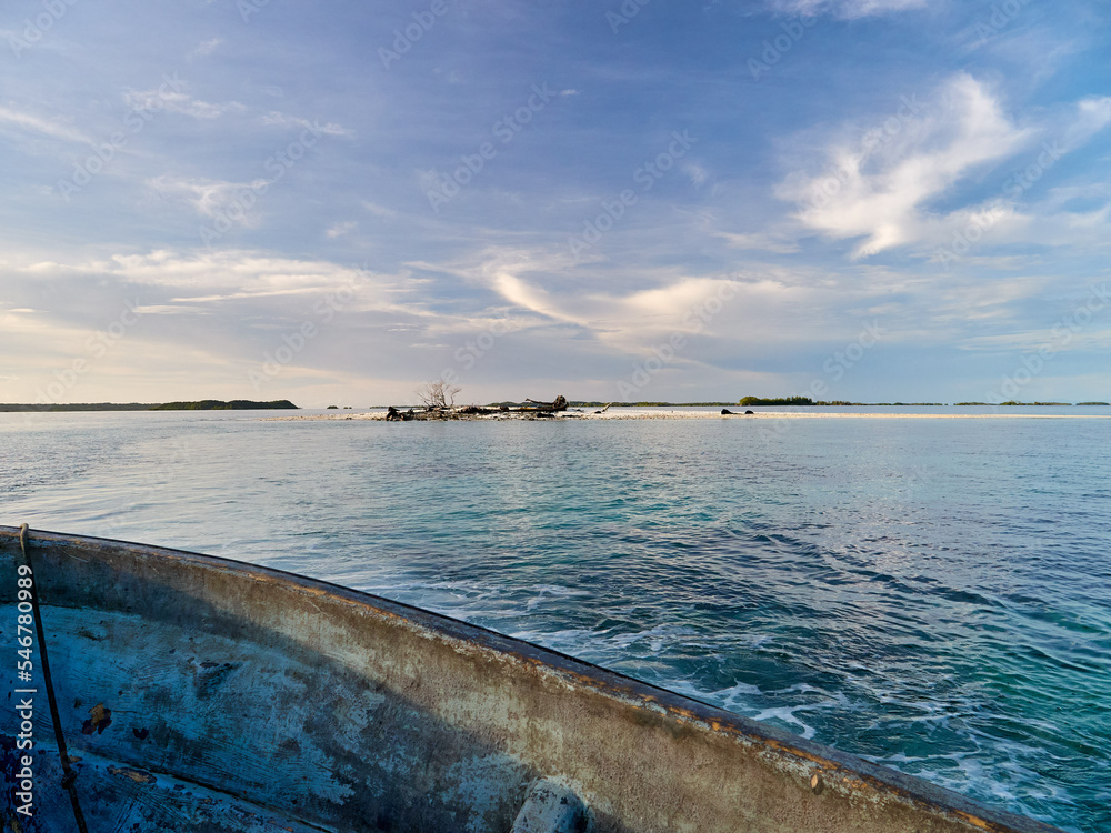 Boat to low-lying island submerged by sea level rise & climate change ...