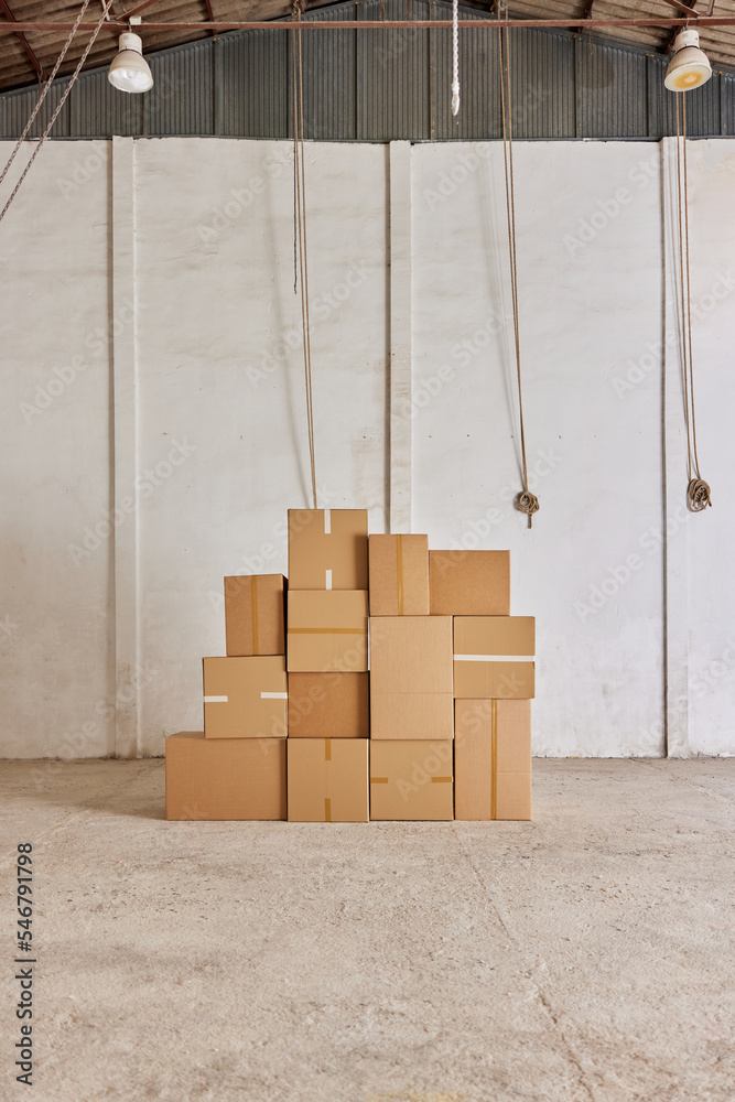 Carton boxes in spacious warehouse Stock Photo | Adobe Stock