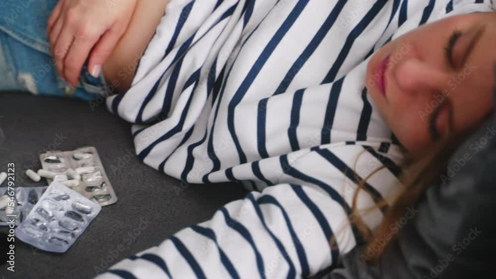 Woman committed a suicide by drug overdose lies on couch at home near ...