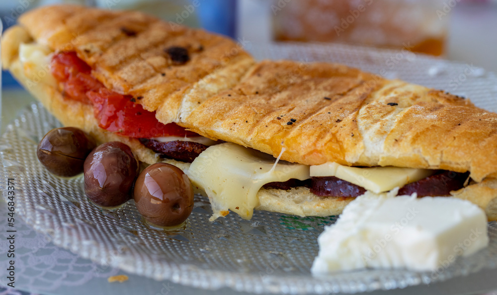 Turkish traditional toast sandwich, cheddar cheese, tomato, sausage ...