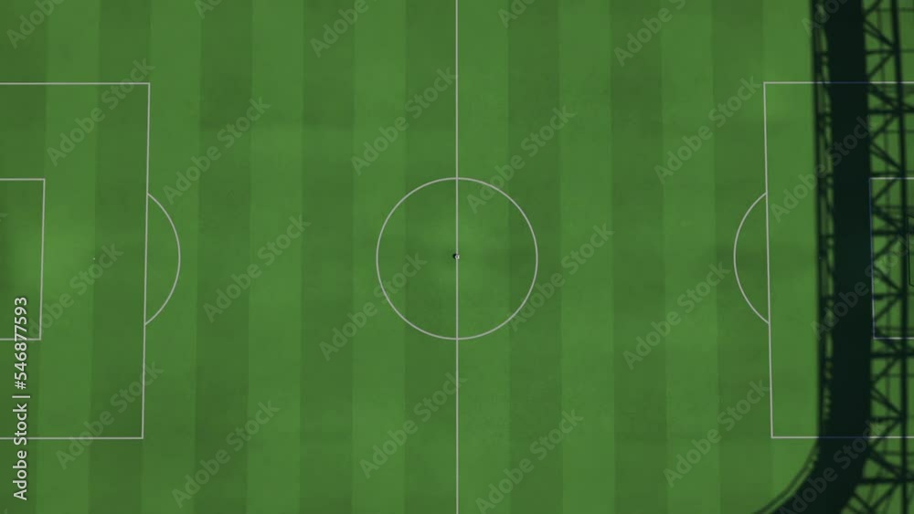 Camera zooms out from the middle of a full football or soccer stadium ...