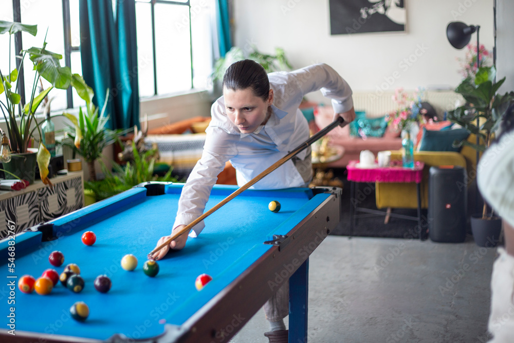 Person playing pool at home Stock Photo | Adobe Stock