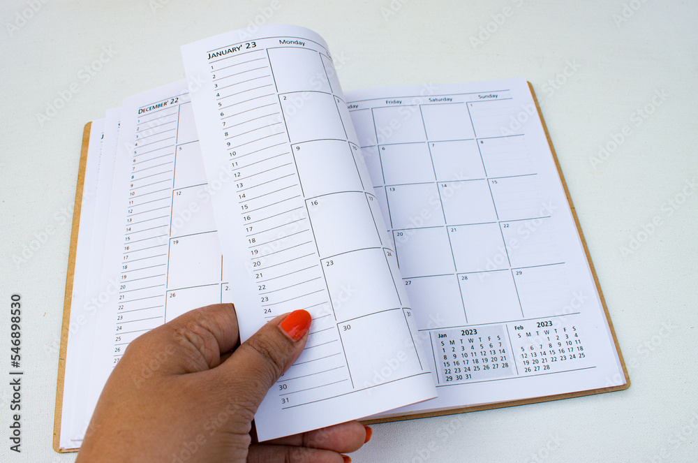 Turning page in diary for writing New year plan, goal and aims. Showing ...