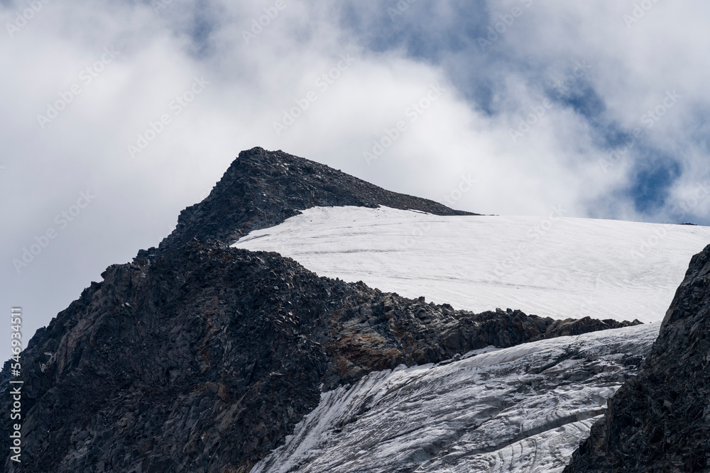 Alpine scene. Ice and snow high in the Alps. Walking the Peiljoch ...