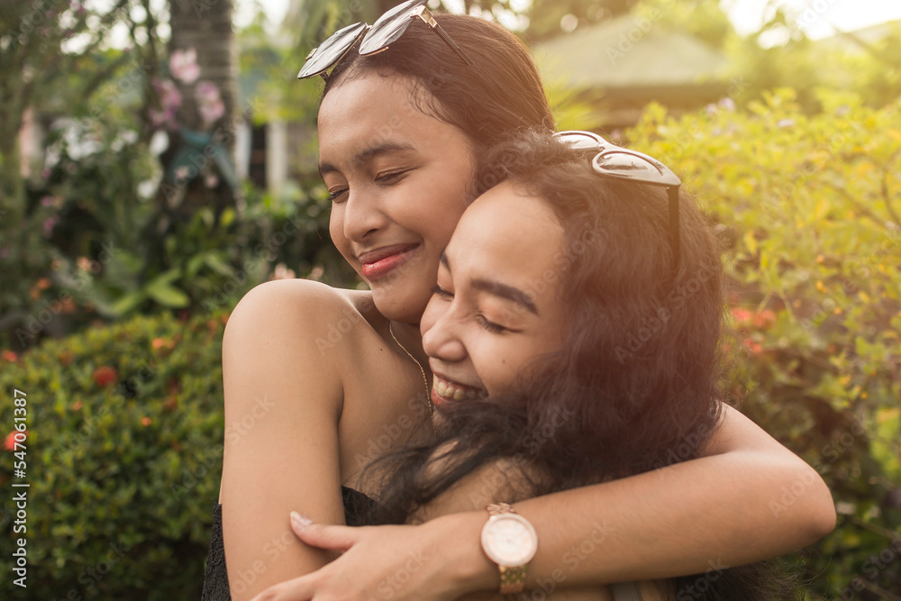 Candid blissful scene of two best friends hugging each other ...
