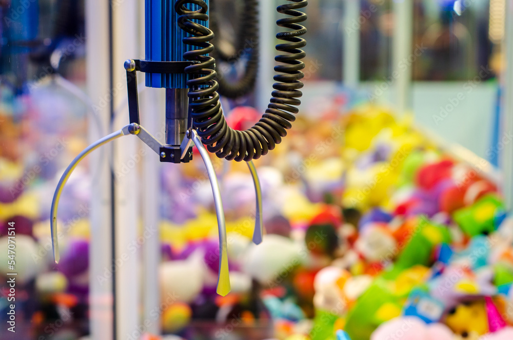 A claw crane game machine with toys Stock Photo | Adobe Stock