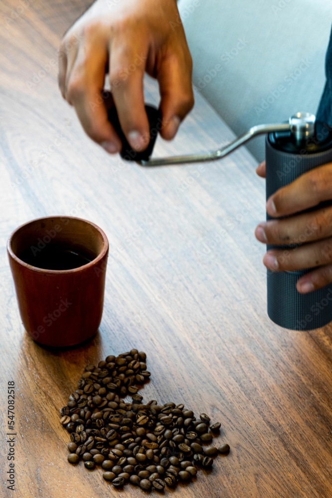 Man Grinding Coffee