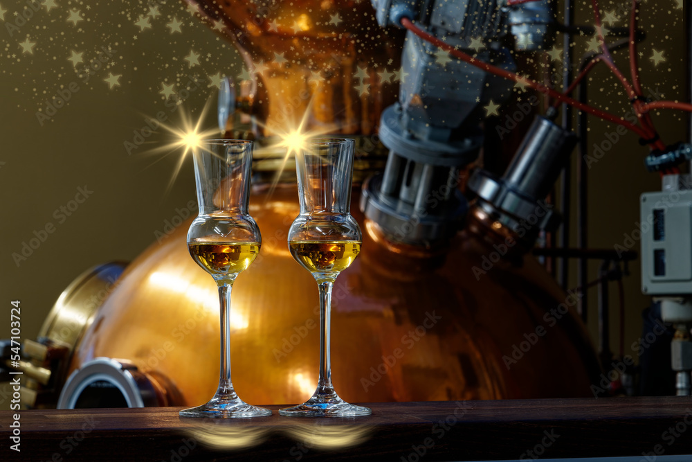 Christmas distiller, liqueur glasses with golden christmas stars in ...