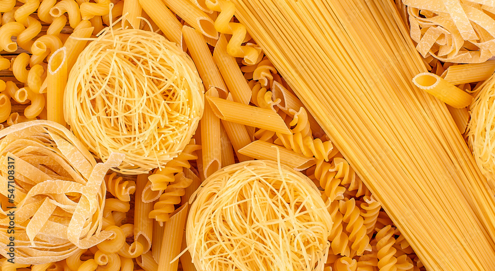 raw pasta, different types and shapes of pasta, durum wheat noodles ...