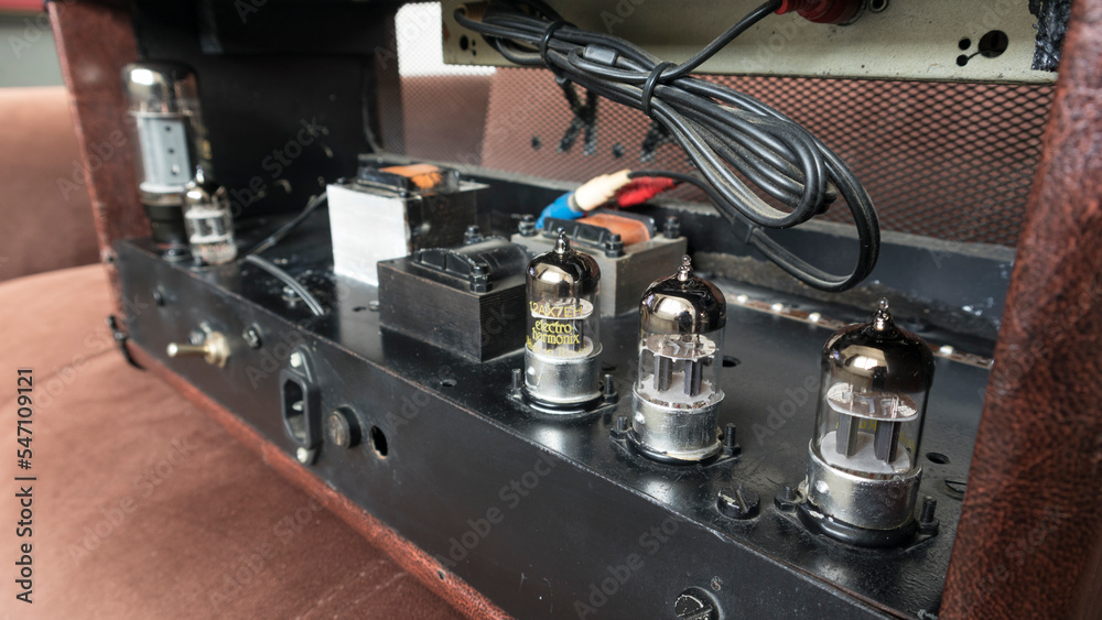 handcrafted brown leather covered amp head in the background 6l6 power ...