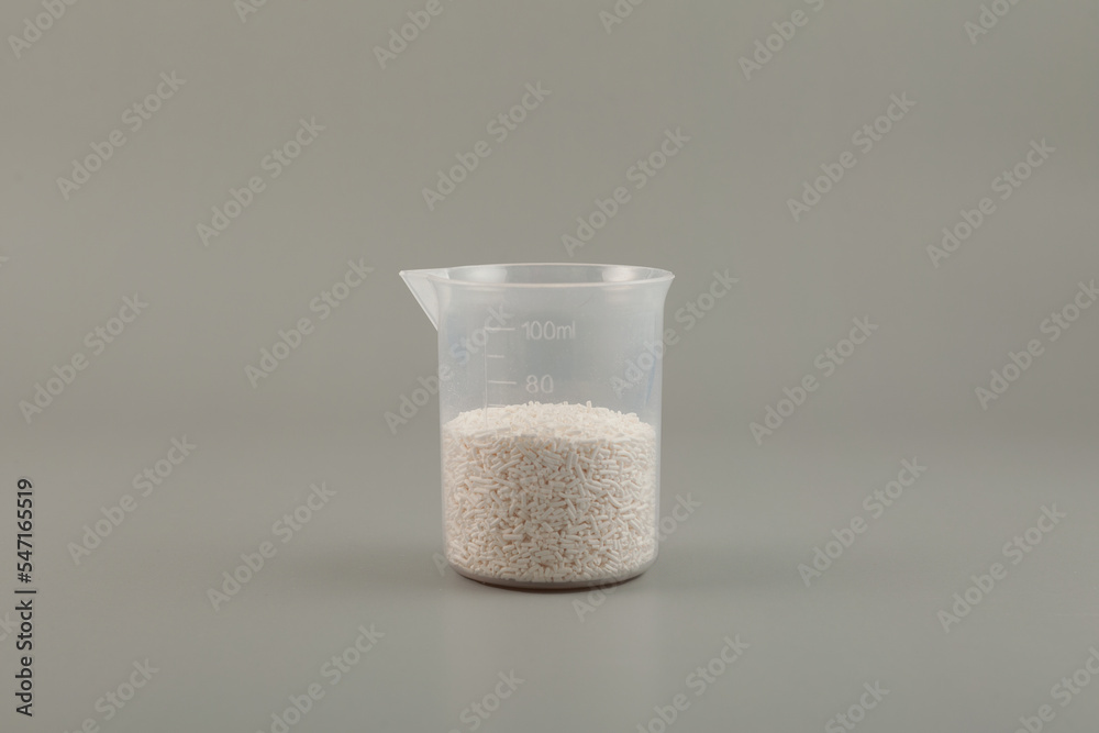 Potassium sorbate, potassium salt of sorbic acid in a plastic measuring ...