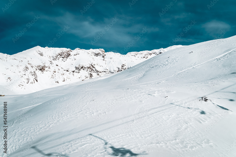 Wild and untouched snowy mountain landscape in breathtaking winter ...