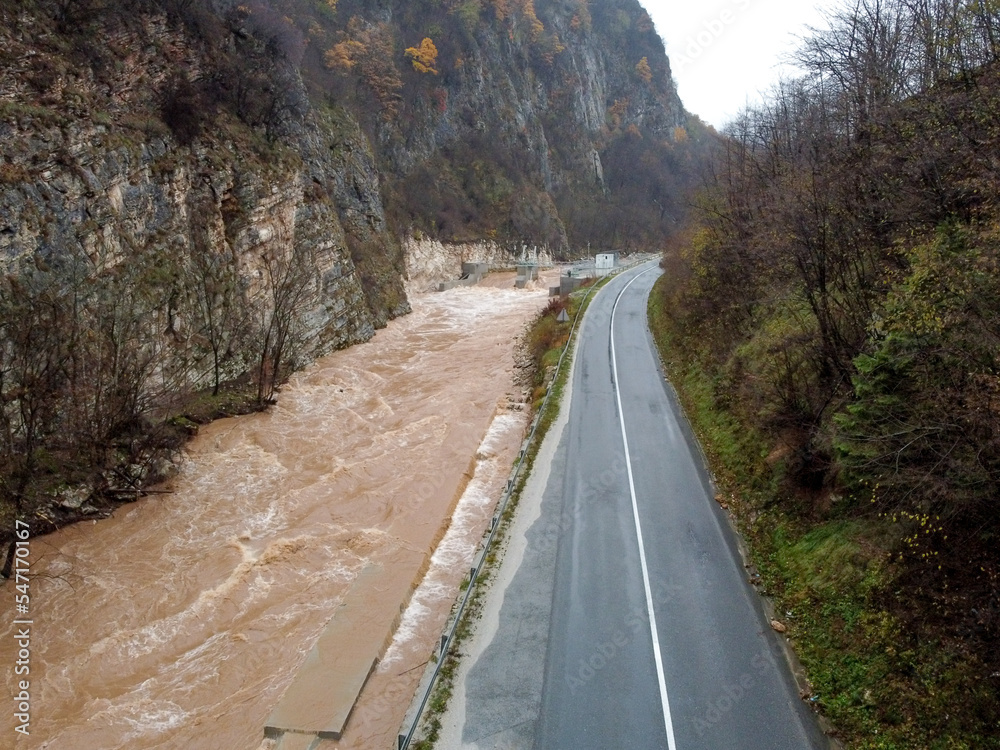 River flood, aerial drone view. Flooded small hydropower plant. Water ...