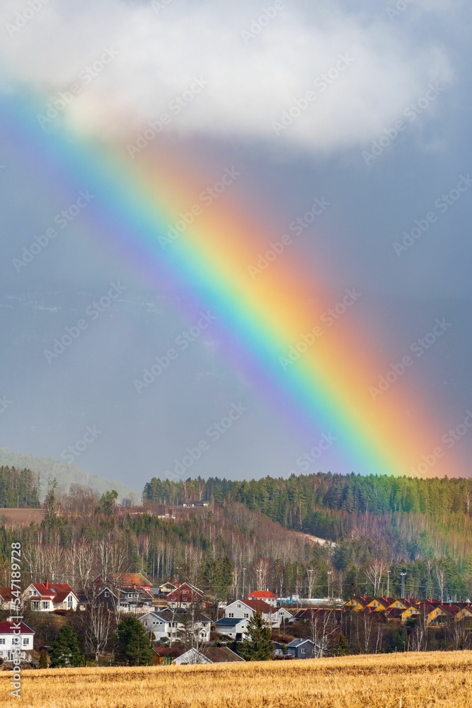 Vertical low-angle of Ankeny Hill Nature center with a rainbow and ...