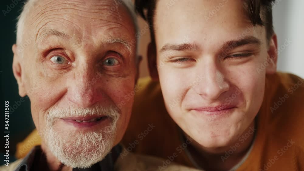 Family portrait of old and young man, grandfather and grandson. Face ...
