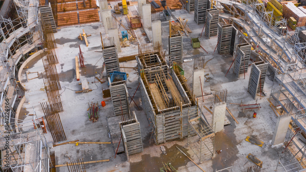 Aerial view on a building under construction. The pillars and the ...
