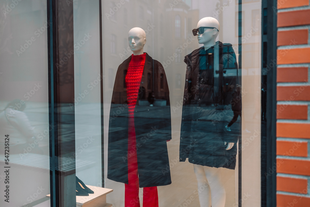 Female mannequins wear luxury style winter clothes. Female mannequins ...