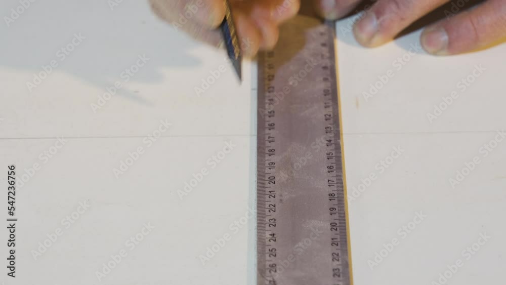 Carpenter's Hands Measures the board with a ruler. Senior carpenter ...