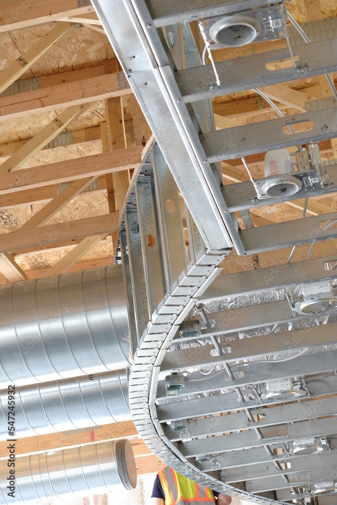 metal stud framing radius soffit and spiral duct Stock Photo | Adobe Stock