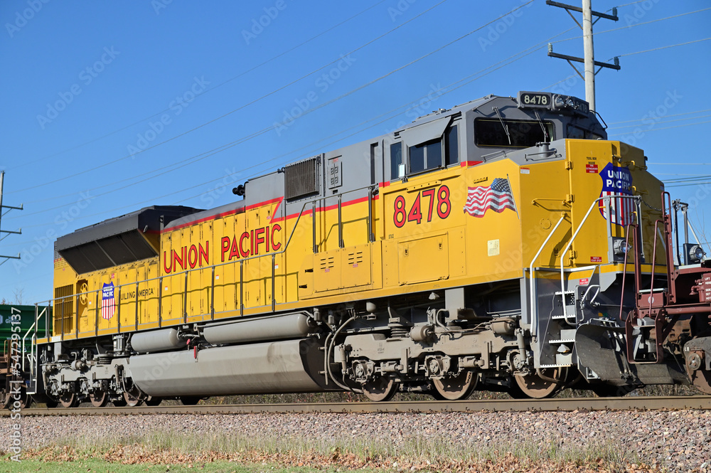 A single locomotive acts as an in-train distributed power unit (DPU) on ...