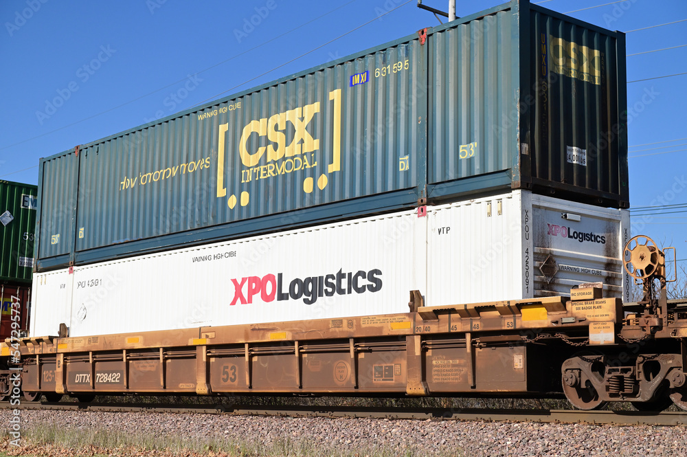 An intermodal freight train passing through the Chicago suburbs. The ...