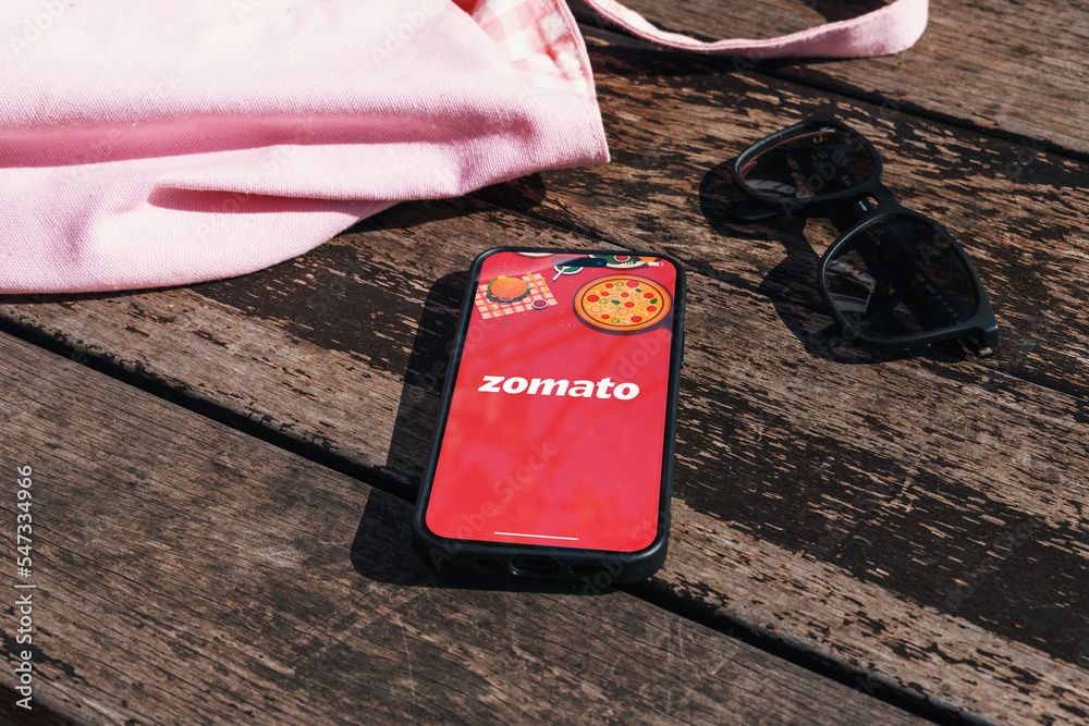 Zomato delivery app on the smartphone iPhone 14 Pro screen on the ...