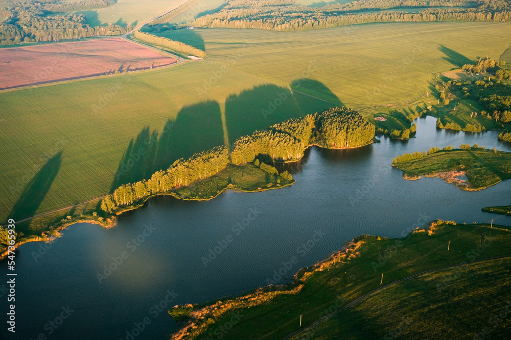 Beautiful view of the summer fields and trees from above from the plane ...