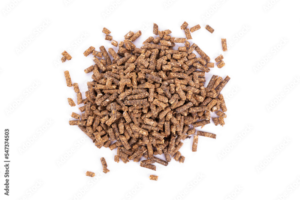 Animal feed. Sunflower granulated feed on white background, close-up ...