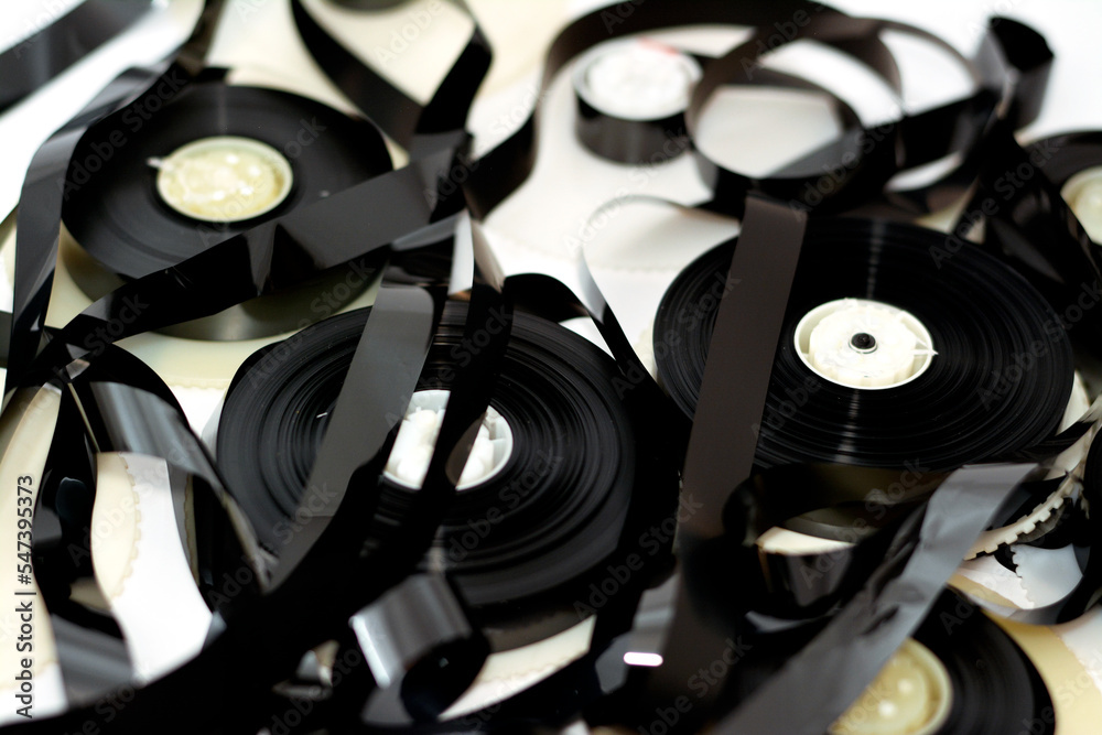 Tape ribbons with the supply and take up reels of VHS video cassette ...