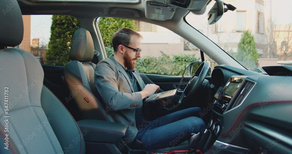 Video Stock Portrait of man businessman working and typing on laptop ...