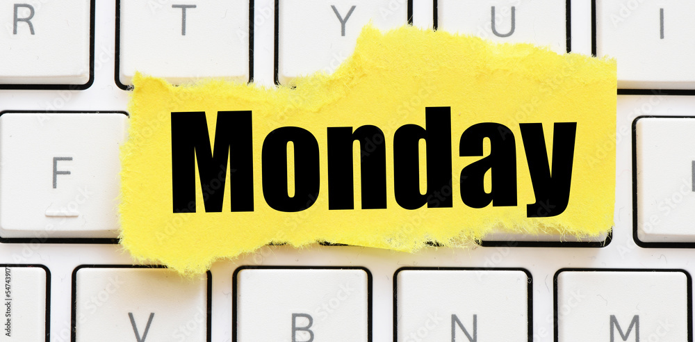 MONDAY on a small yellow sheet of paper lay on the keyboard. Stock ...