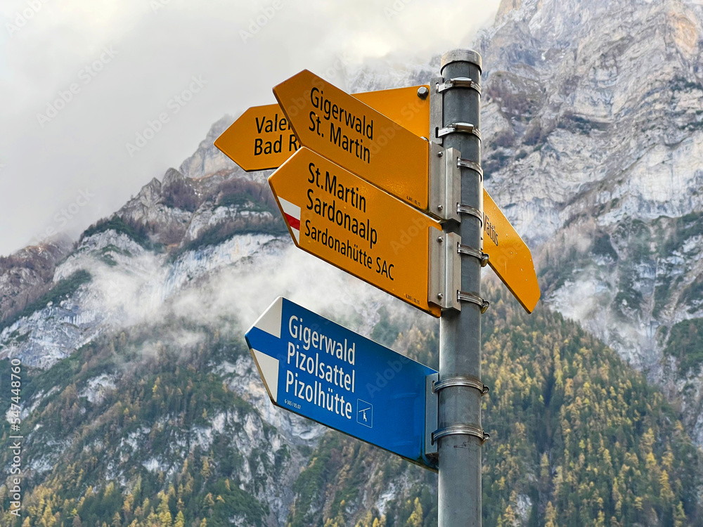 Mountaineering signposts and markings on the slopes of the alpine ...