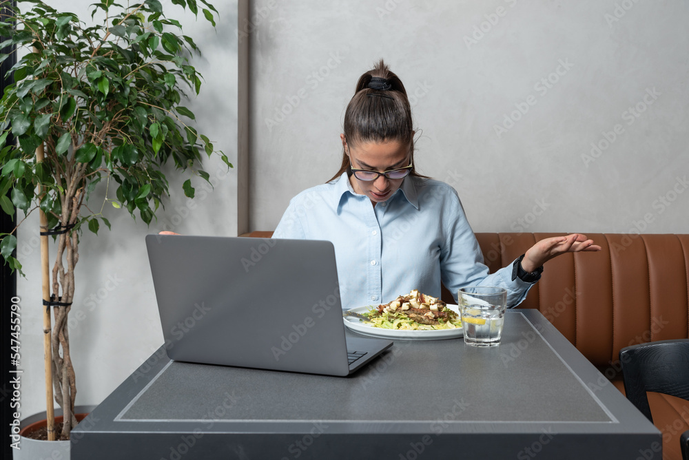 Gorgeous cheerful woman freelancer with good mood and laptop computer ...