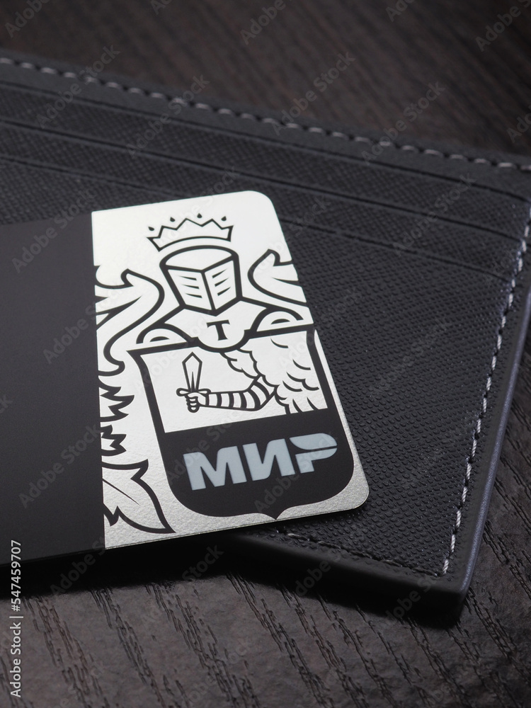 Illustrative editorial. Plastic card of Russian bank Tinkoff lies on ...