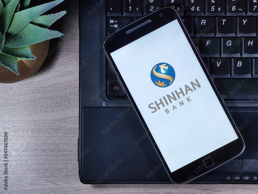 Smartphone displaying logo of Shinhan Bank, a bank headquartered in ...