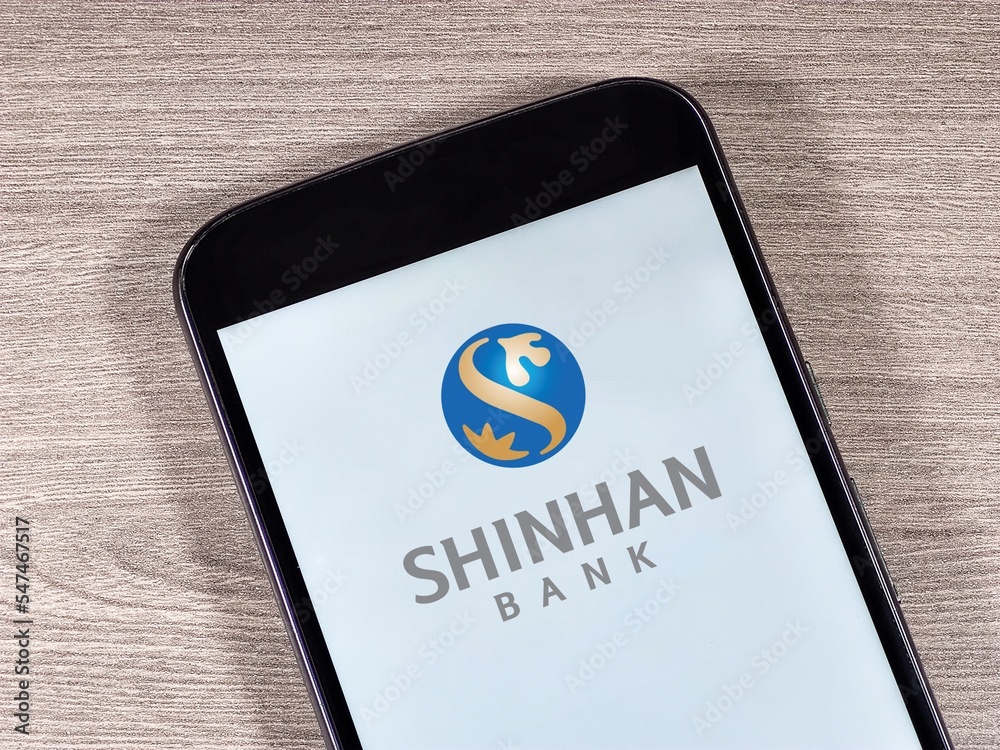 Smartphone displaying logo of Shinhan Bank, a bank headquartered in ...