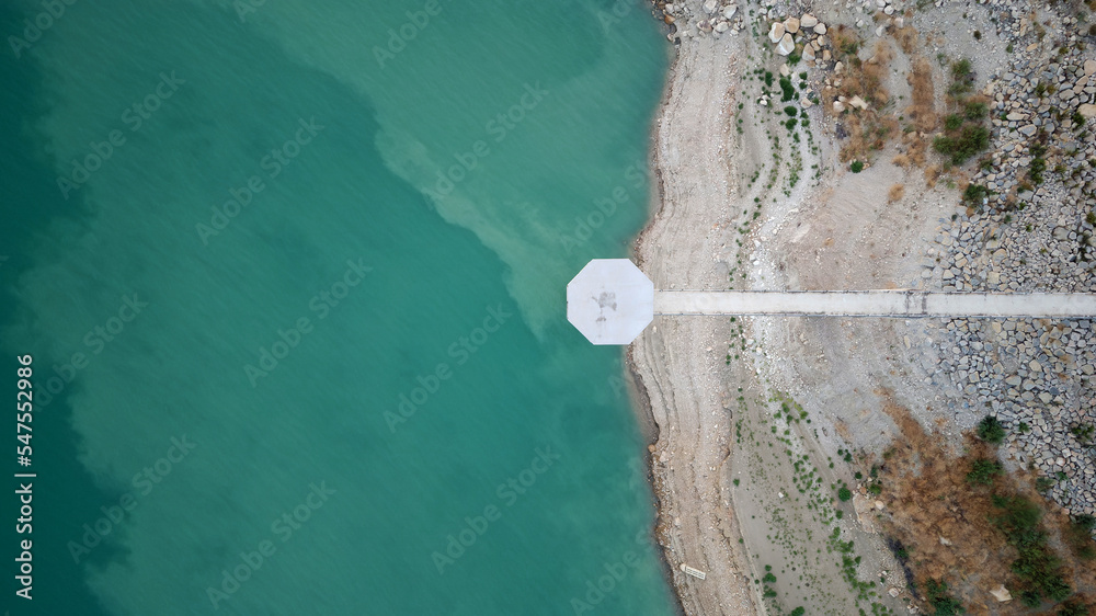 Aerial drone view of low levels of the dam river. Shortage of water ...